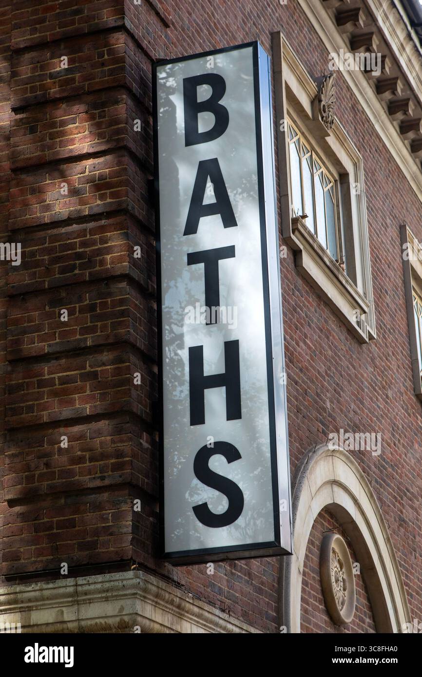 Sign on the exterior of Ironmonger Baths on Norman Street in London, UK ...