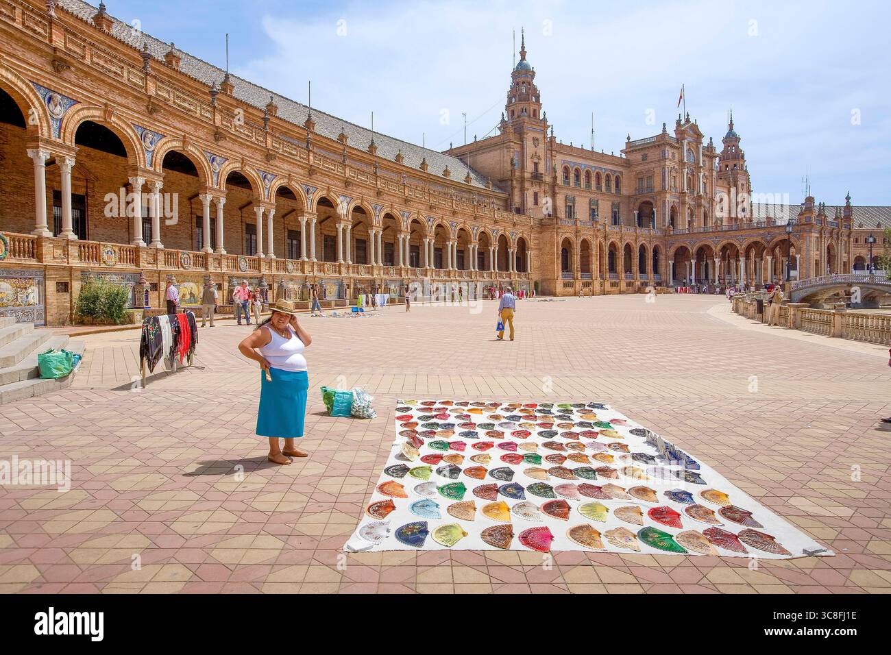 Spain, street vendor of typical spanish hand fans on Plaza de Espana ...