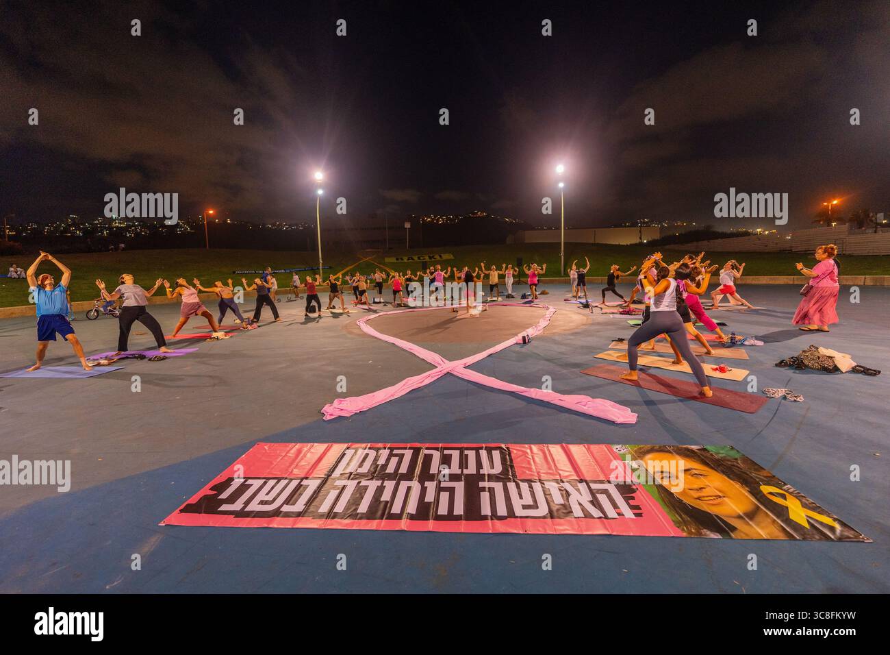 Haifa, Israel - July 30, 2025: People attend a Yoga session, calling ...