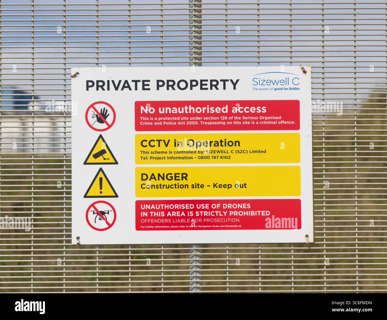 Private property sign on the perimeter security fence surrounding the ...