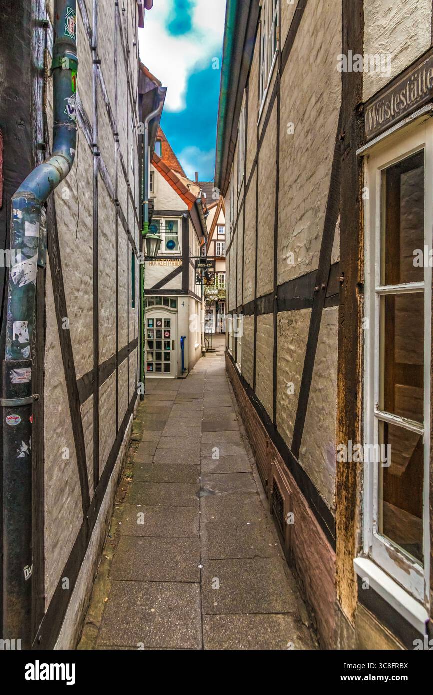 Great view of a narrow alleyway between half-timbered medieval houses ...