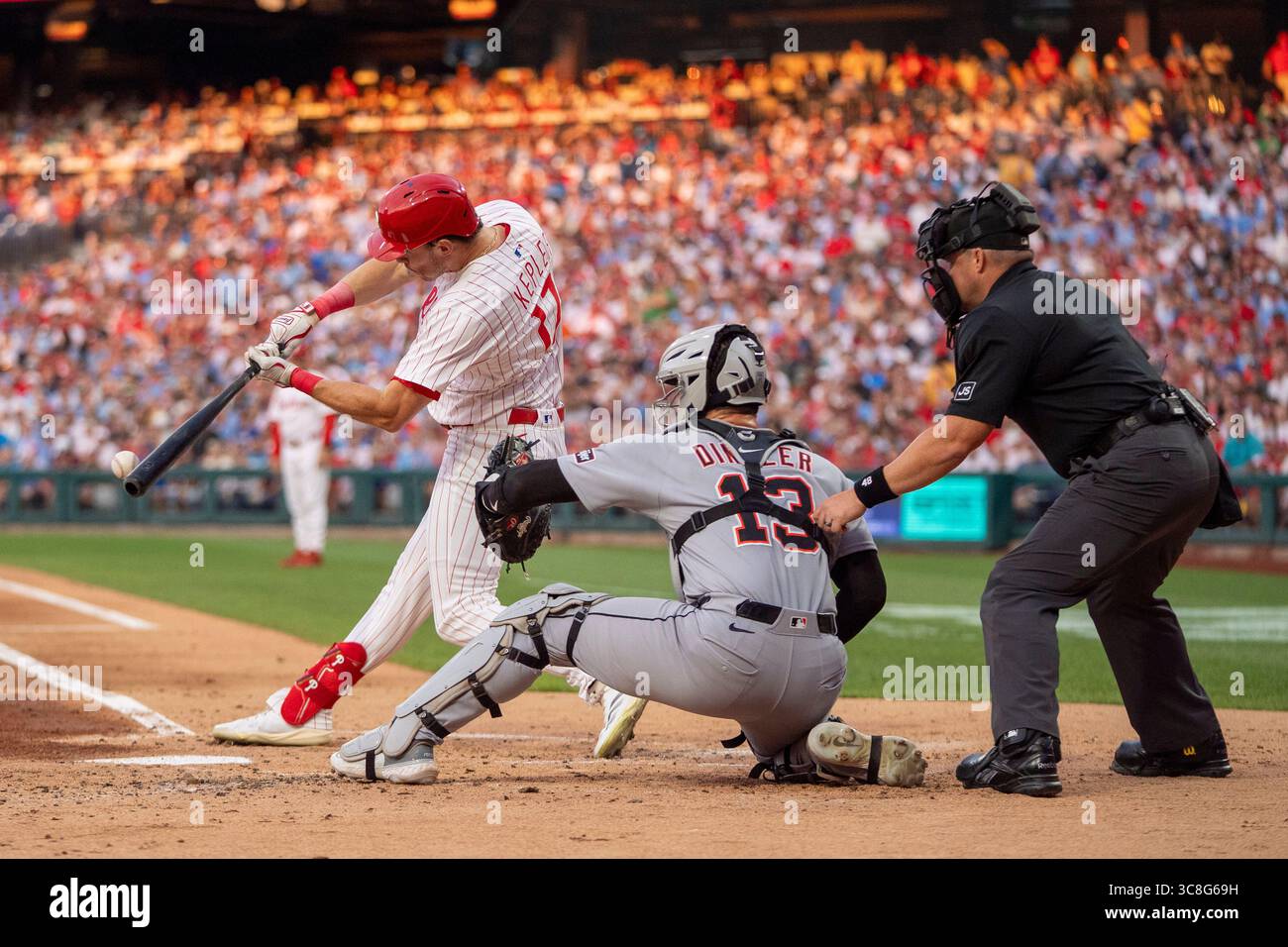 Philadelphia Phillies' Max Kepler hits into a fielder choice to score a ...