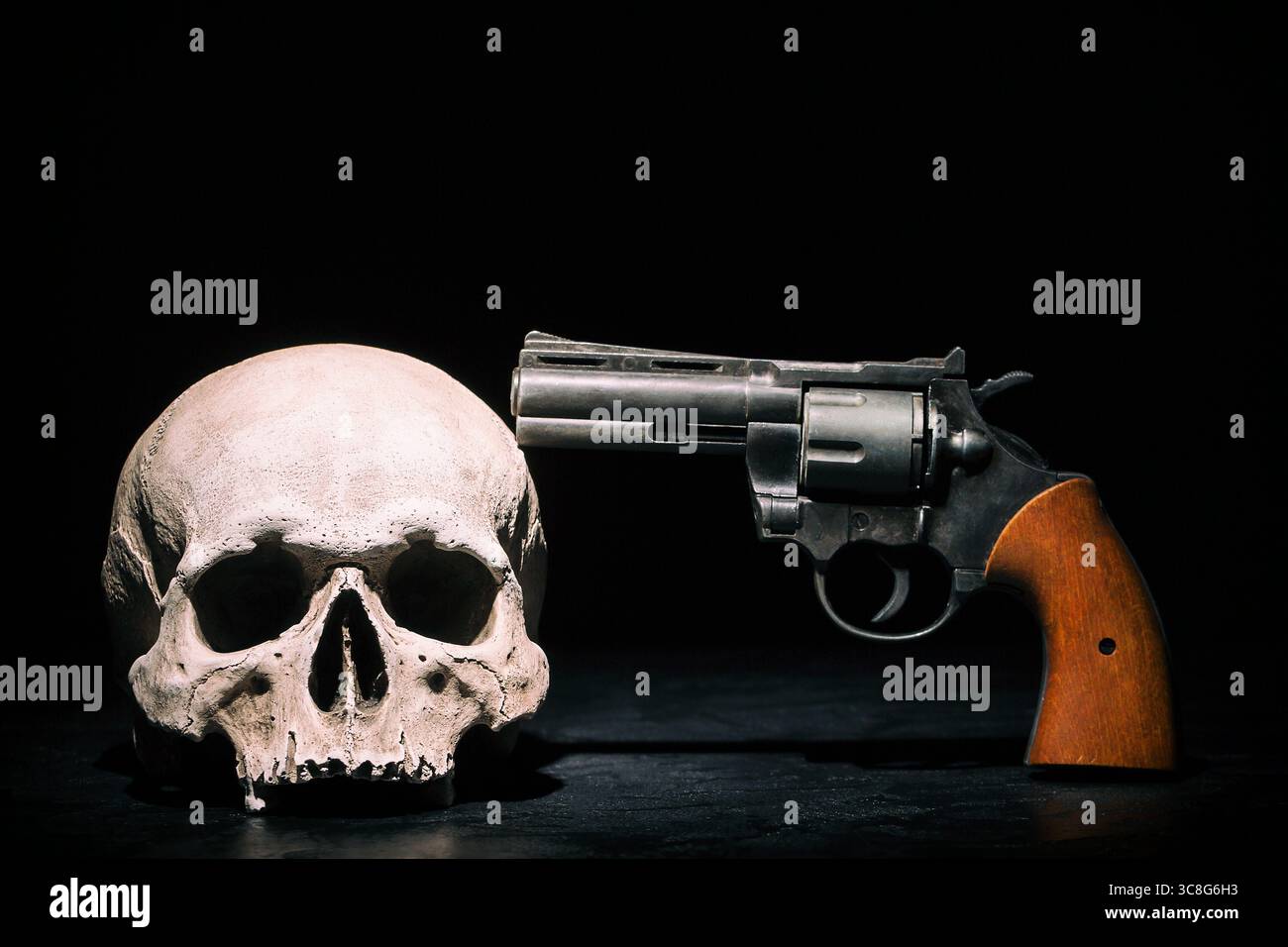 Mafia, justice and murderment crime concept. Human skull with revolver ...