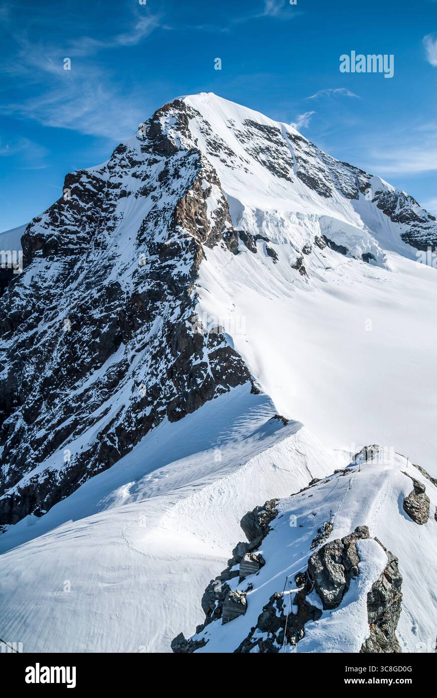 The image is of the Southwest face of the Moench Peak 4110m mountain in ...