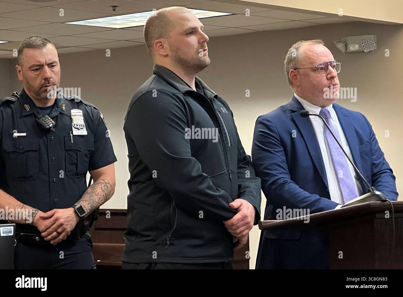FILE - Correctional officer Christopher Walrath, center, appears in ...
