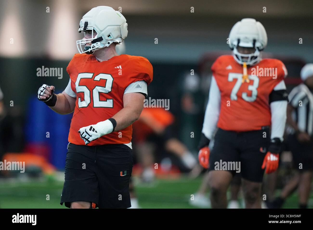 Miami offensive lineman James Brockermeyer (52) does drills during NCAA ...