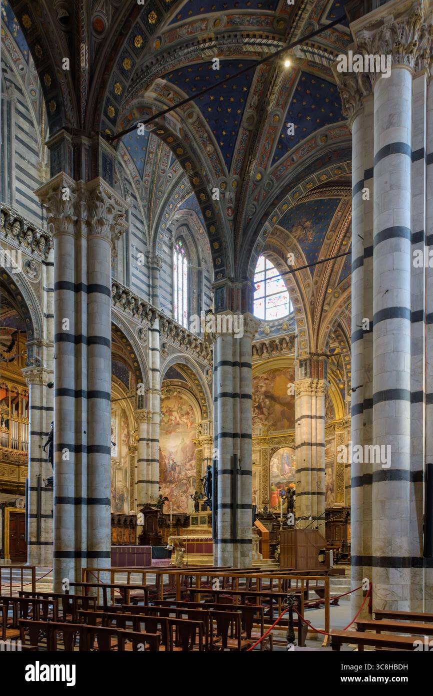 The interior of the Cathedral of Siena (Duomo di Siena), the nave with ...