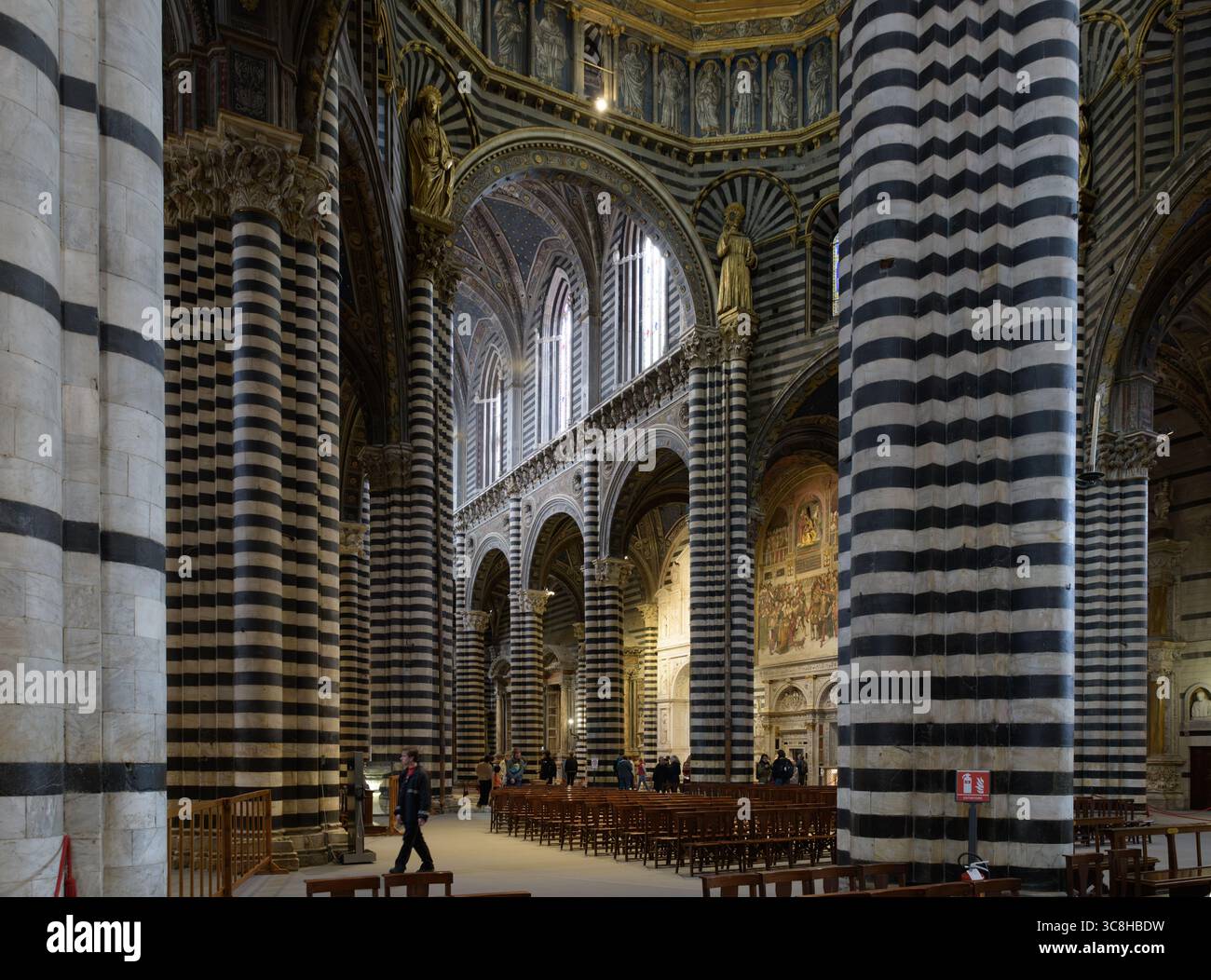 The interior of the Cathedral of Siena (Duomo di Siena), the nave with ...