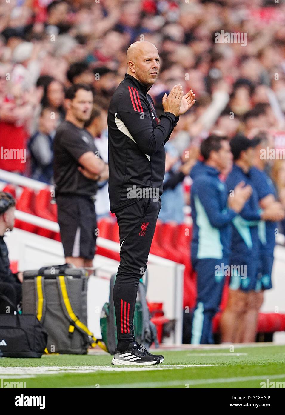 Liverpool manager Arne Slot claps as the crowd play tribute to Diogo Jota in the 20th minute ...