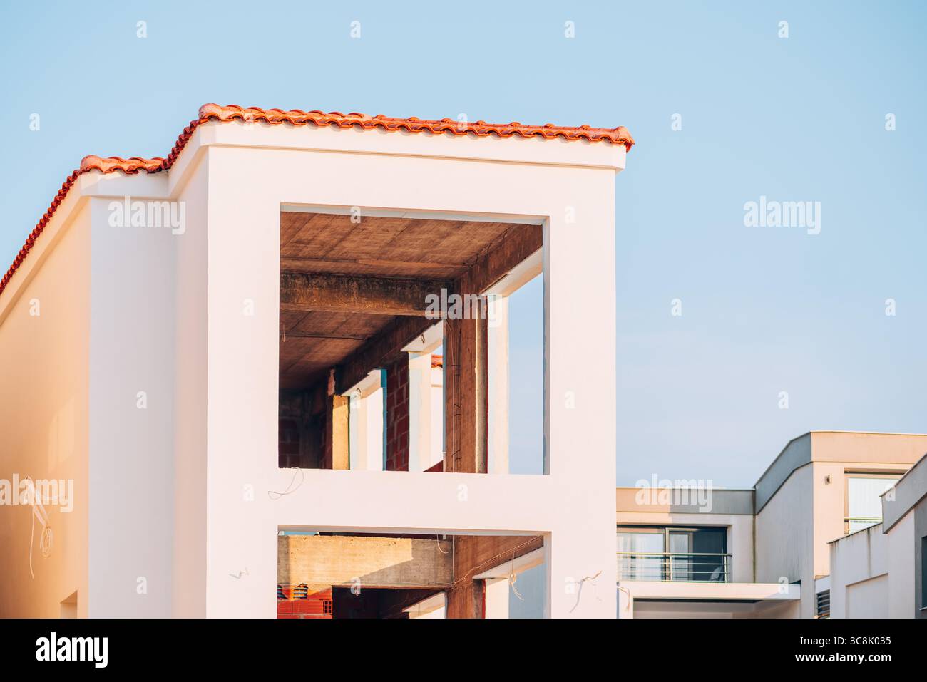 Minimalist view of an unfinished modern building with open concrete ...