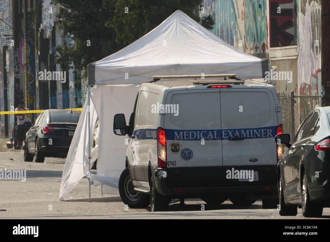 Los Angeles Coroner Medical Examiner arrives to remove the bodies of ...
