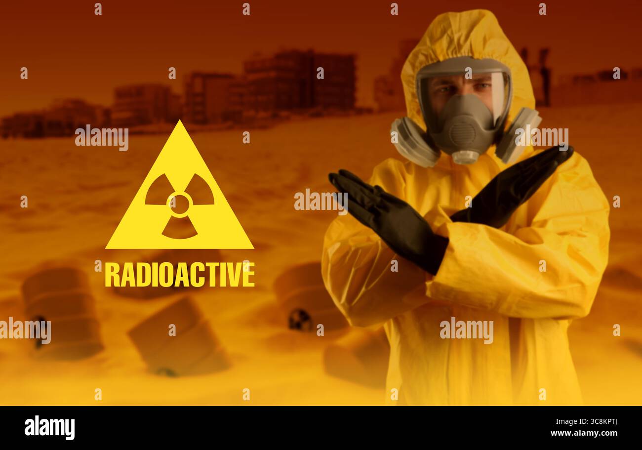 Radioactive hazard. Man in hazmat suit and gas mask blocking way to ...