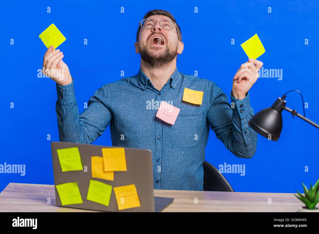 Exhausted man sitting table pasted hi-res stock photography and images ...