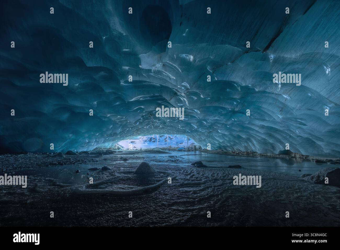 The interior of an ice cave with interesting patterns of the huge vault ...