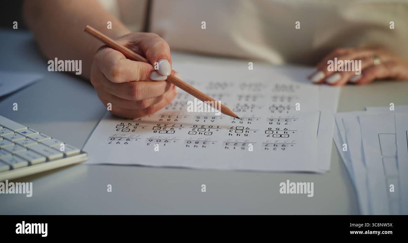 Female math teacher checking hi-res stock photography and images - Alamy