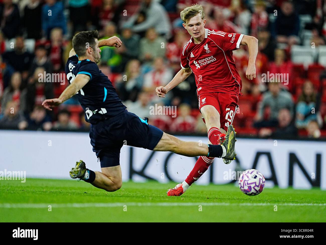 Liverpool's Will Wright has a shot on goal during the pre-season ...