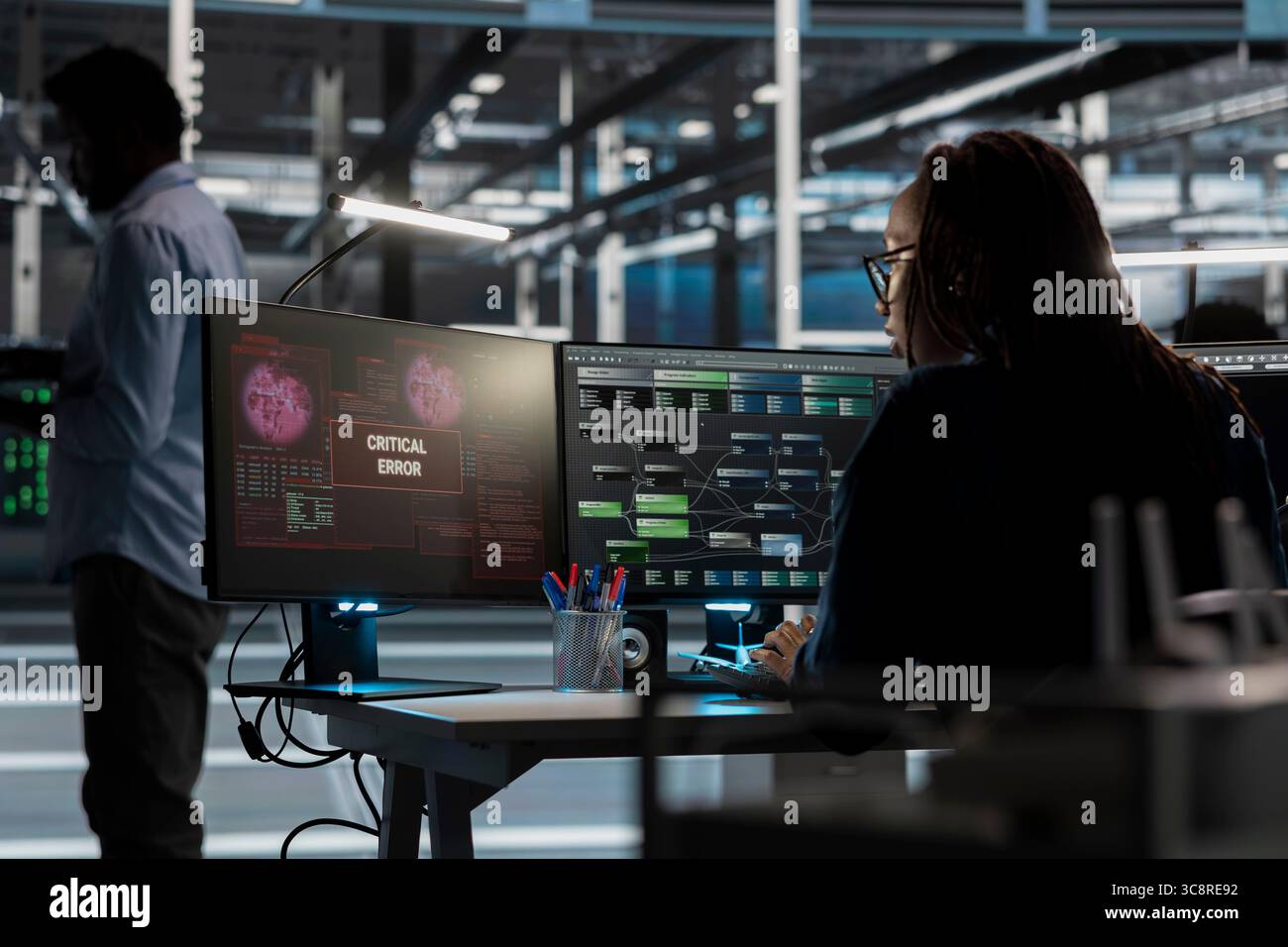 Woman in server room finding glitches while overseeing AI systems. Data ...
