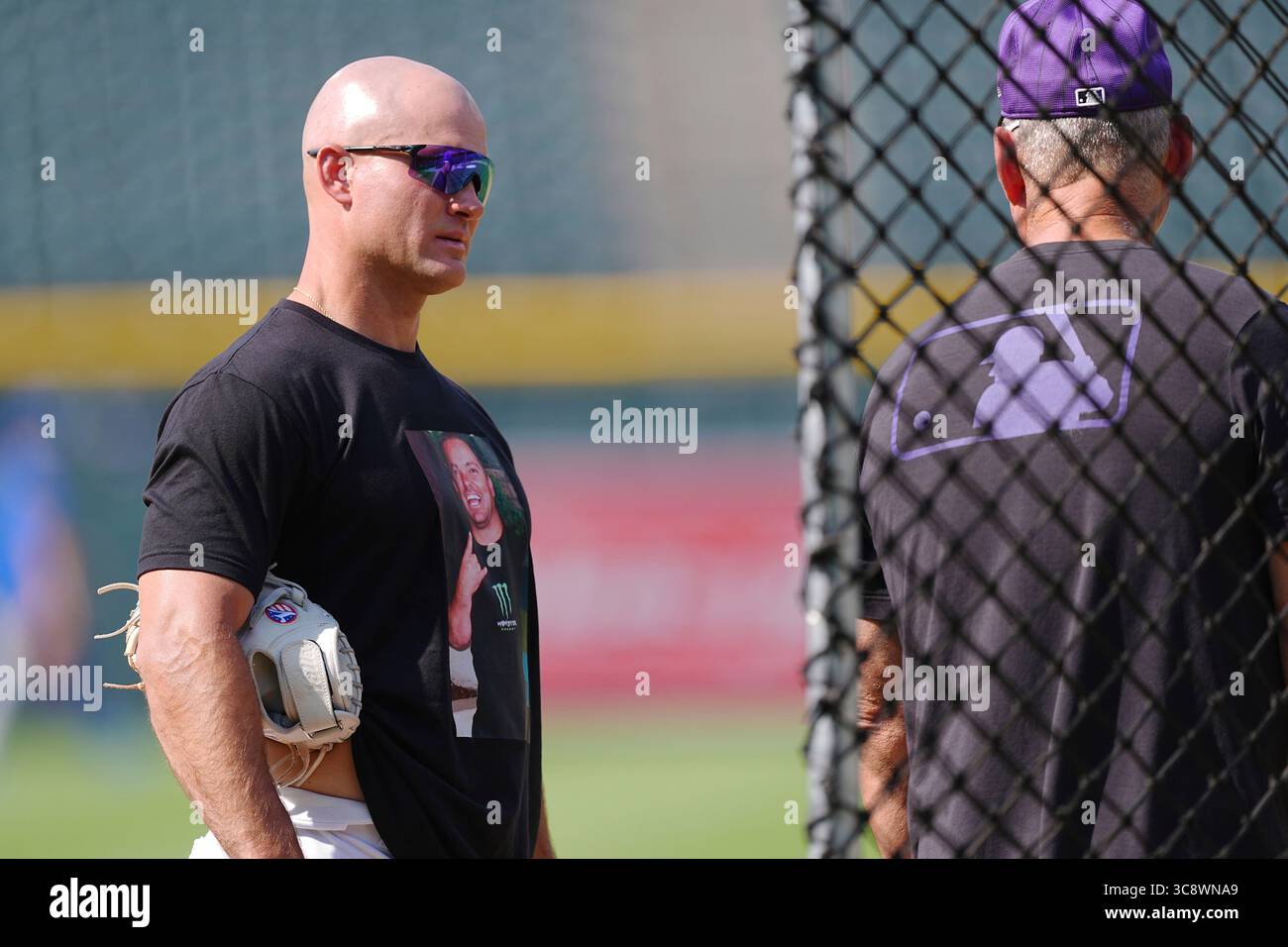Colorado Rockies interim manager Warren Schaeffer, left, confers with ...