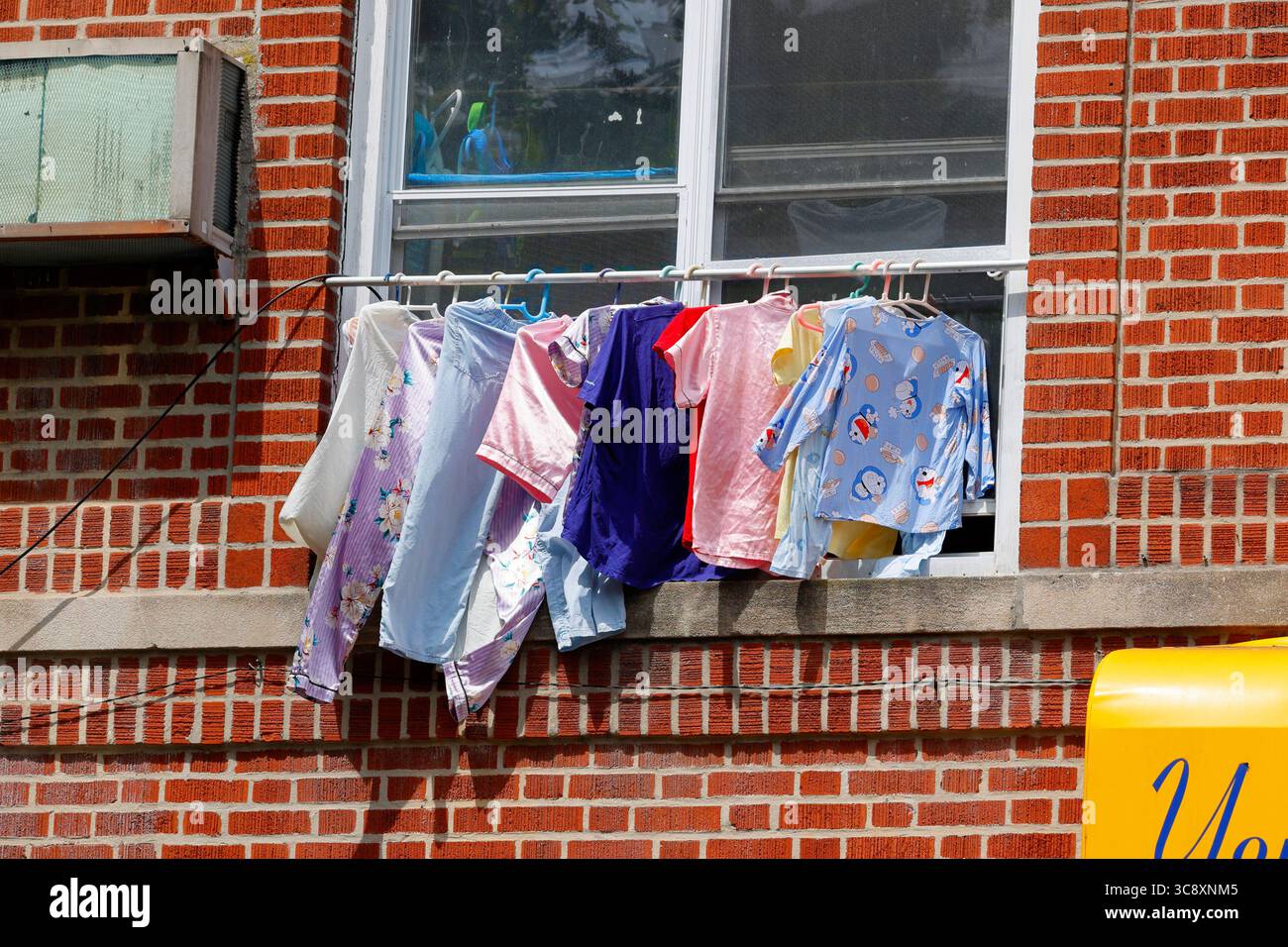 Clothing drying on a clothesline washing line outside an apartment ...
