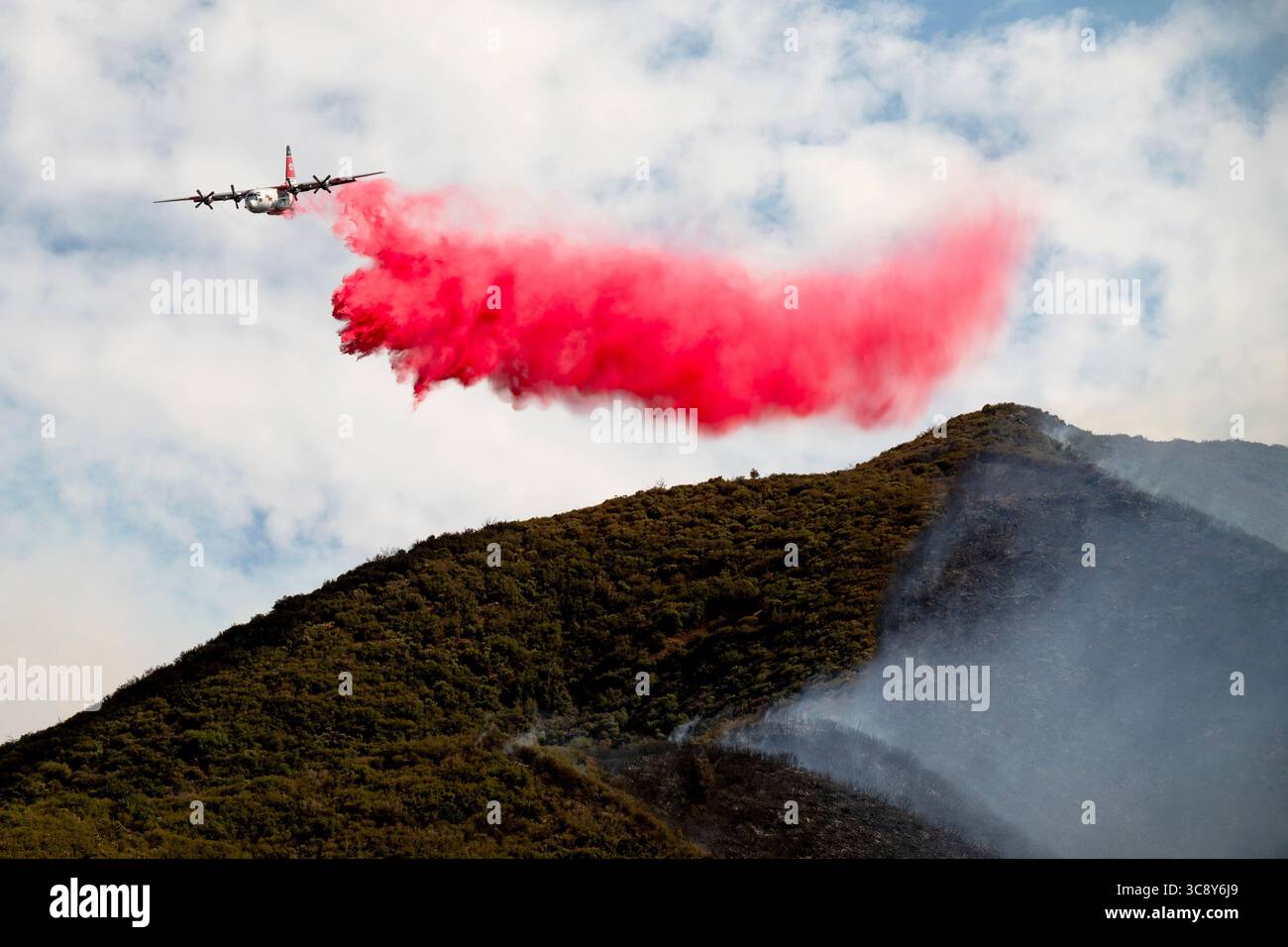 An air tanker drops retardant on the Gifford Fire burning on Monday ...