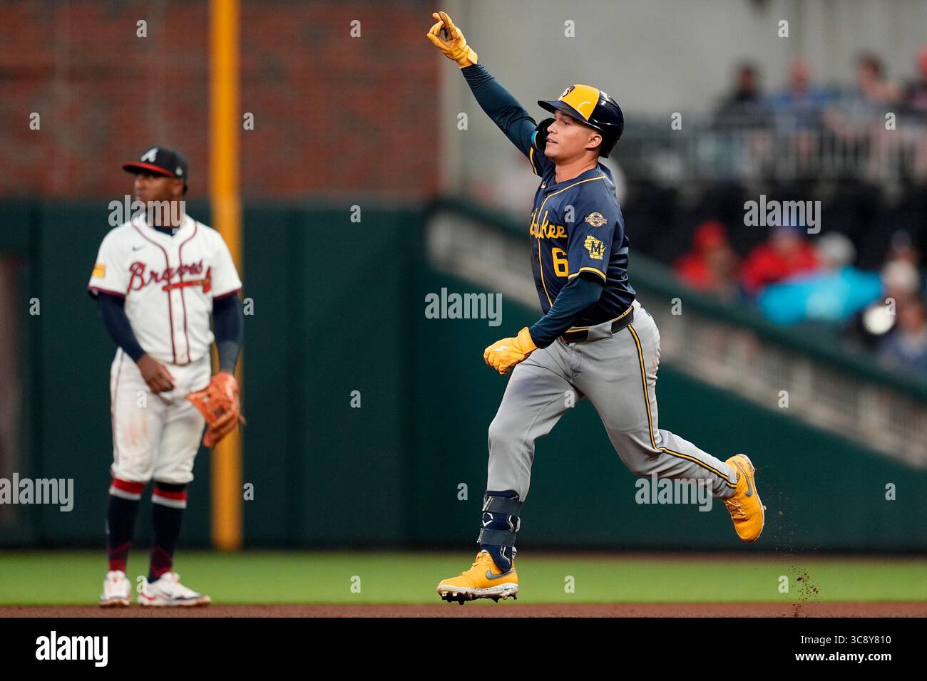 Milwaukee Brewers' Isaac Collins (6) celebrates his three-run home run ...