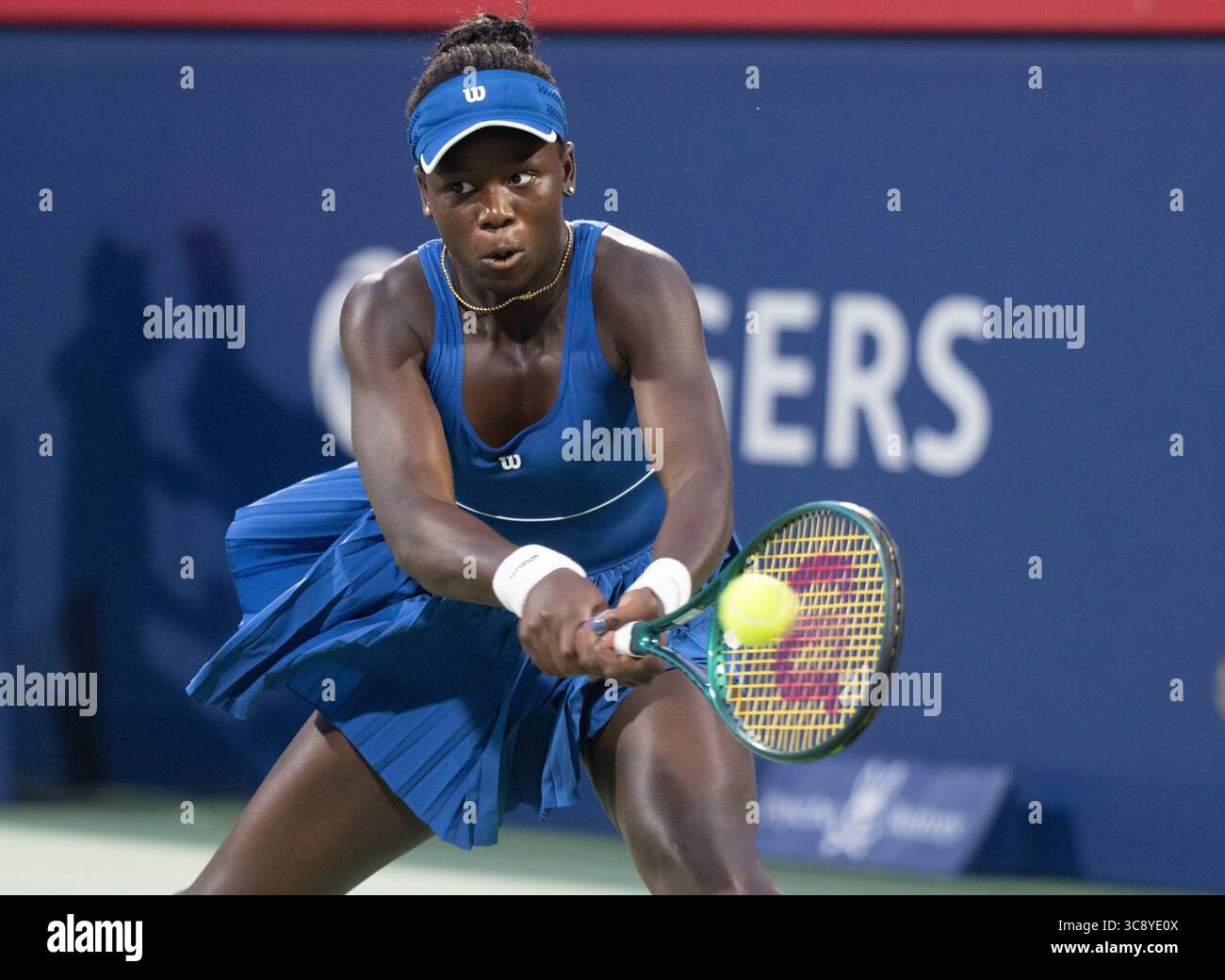Victoria Mboko, of Canada, hits a return to Jessica Bouzas Maneiro, of ...