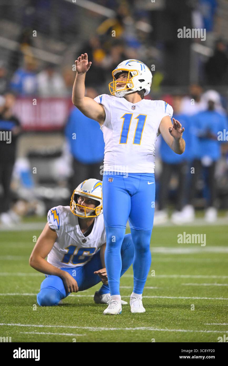 Los Angeles Chargers place kicker Cameron Dicker (11) watches the ball ...