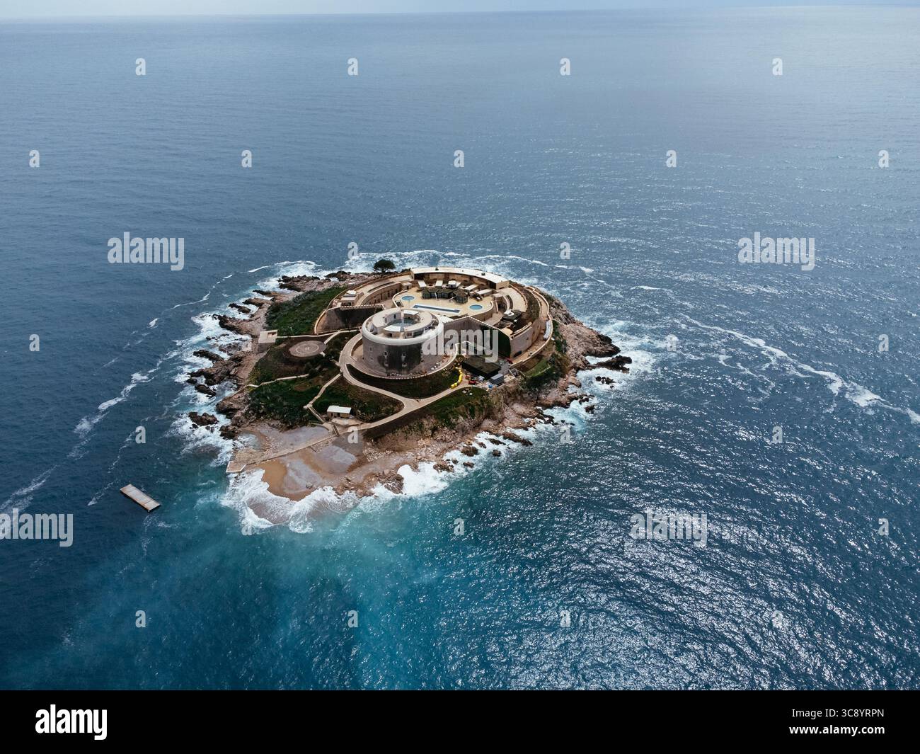 Aerial view of historic coastal fortress on Adriatic Sea islet in ...