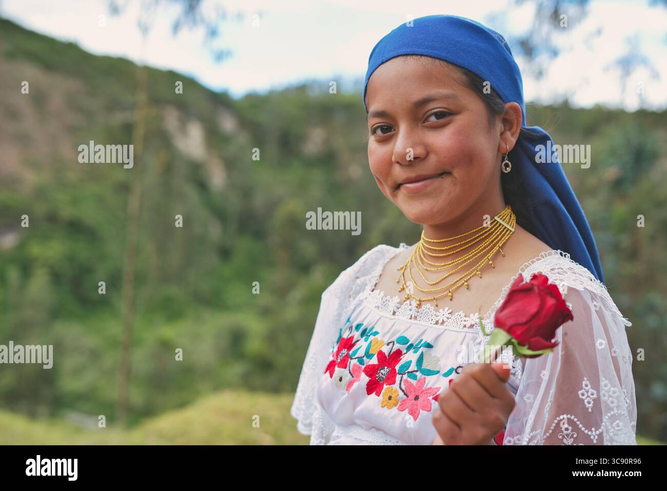Indigenous colombian girl holding a red rose and smiling Stock Photo ...
