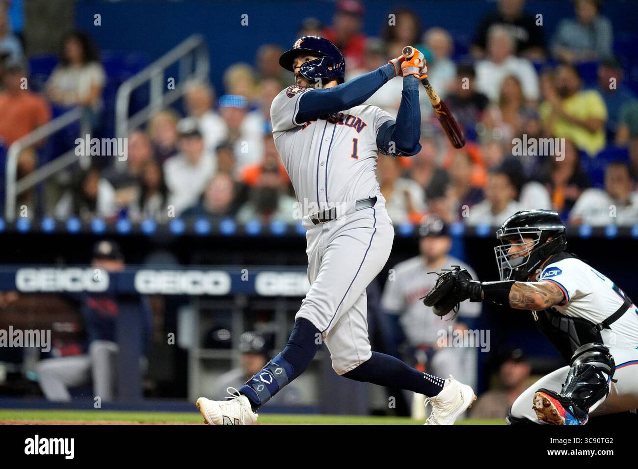 Houston Astros' Carlos Correa watches his ball as he hits a fly out in ...