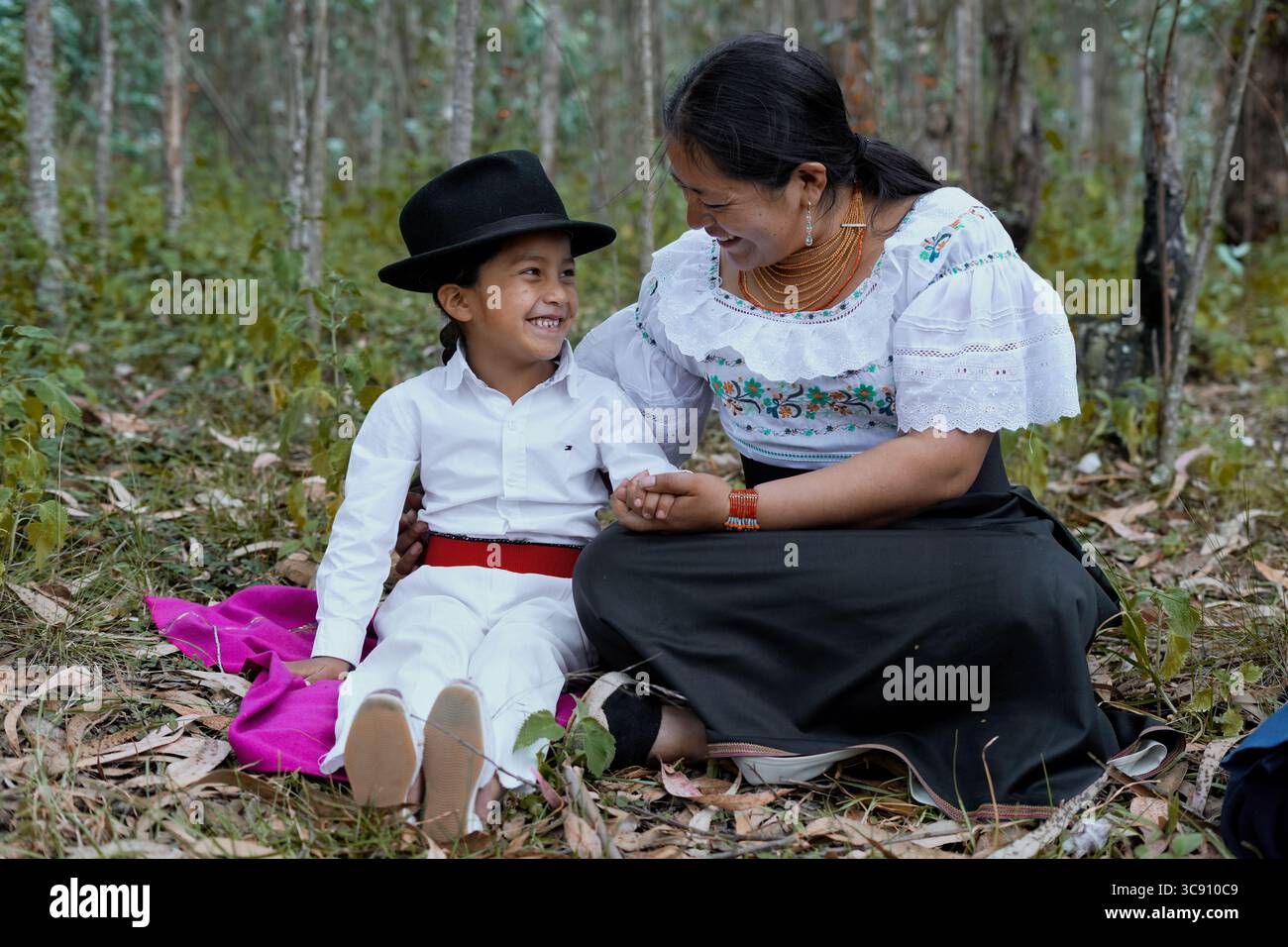 Indigenous mother and son sharing a tender moment in nature Stock Photo ...