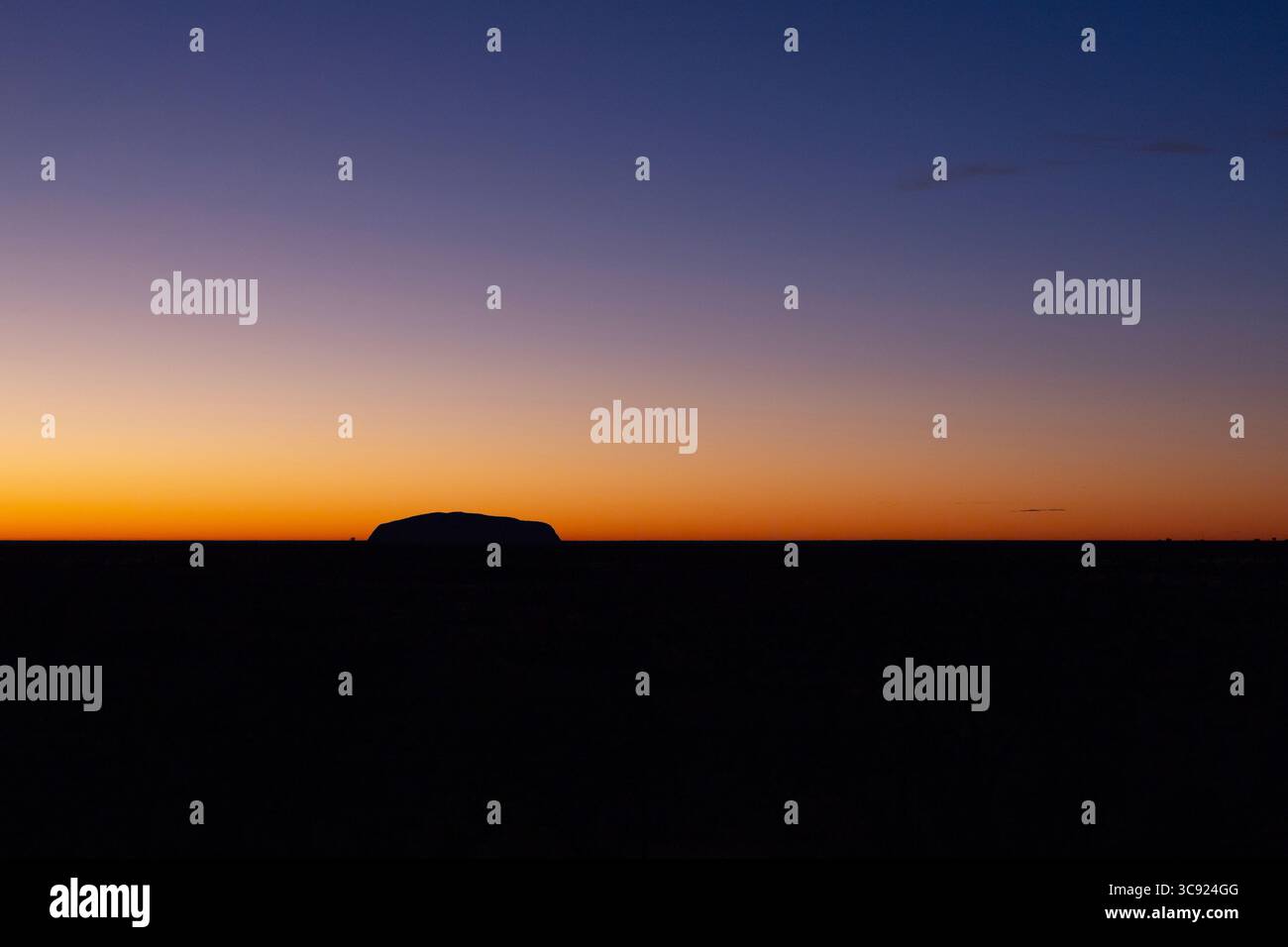 Uluru at sunrise. In Kata Tjuṯa National Park on in the Northern ...
