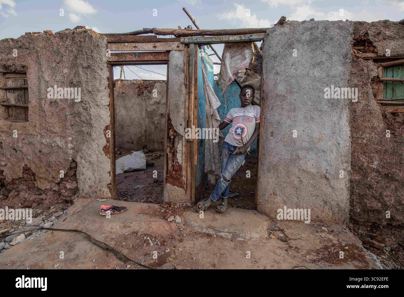 March 1, 2021, Nairobi, Kenya: A homeless boy standing on the rubbles ...