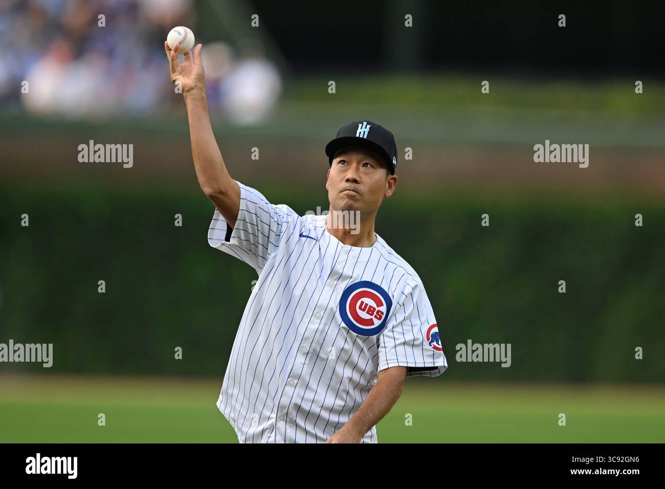 Professional golfer Kevin Na throws out the ceremonial first pitch ...