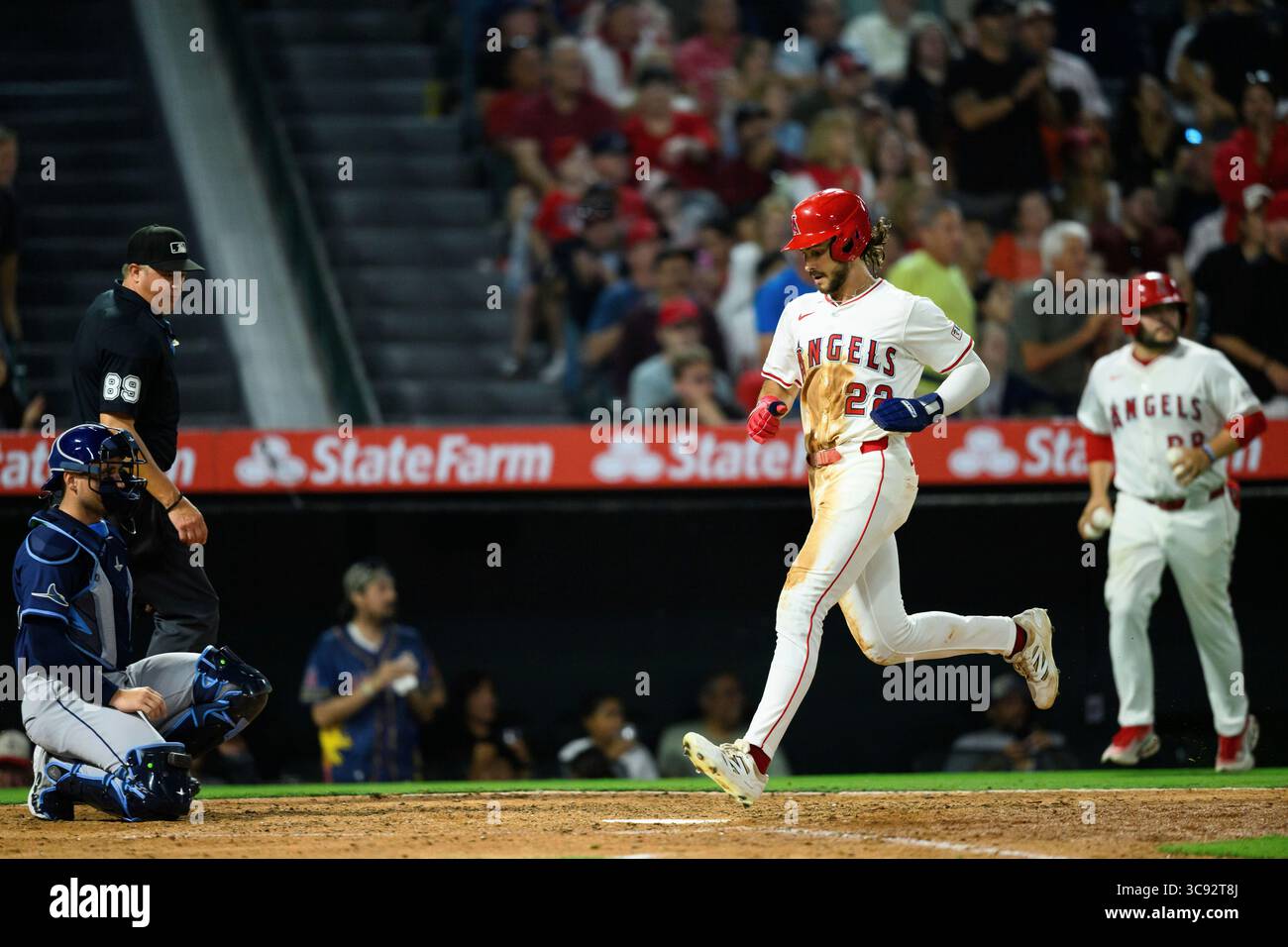 Los Angeles Angels' Bryce Teodosio, center, scores during the sixth ...