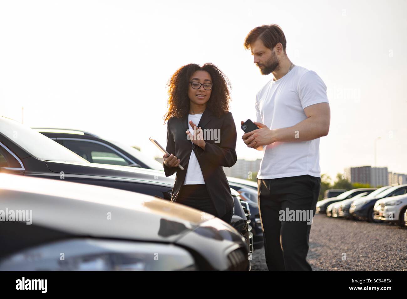 Car dealer explaining sales contract hi-res stock photography and ...
