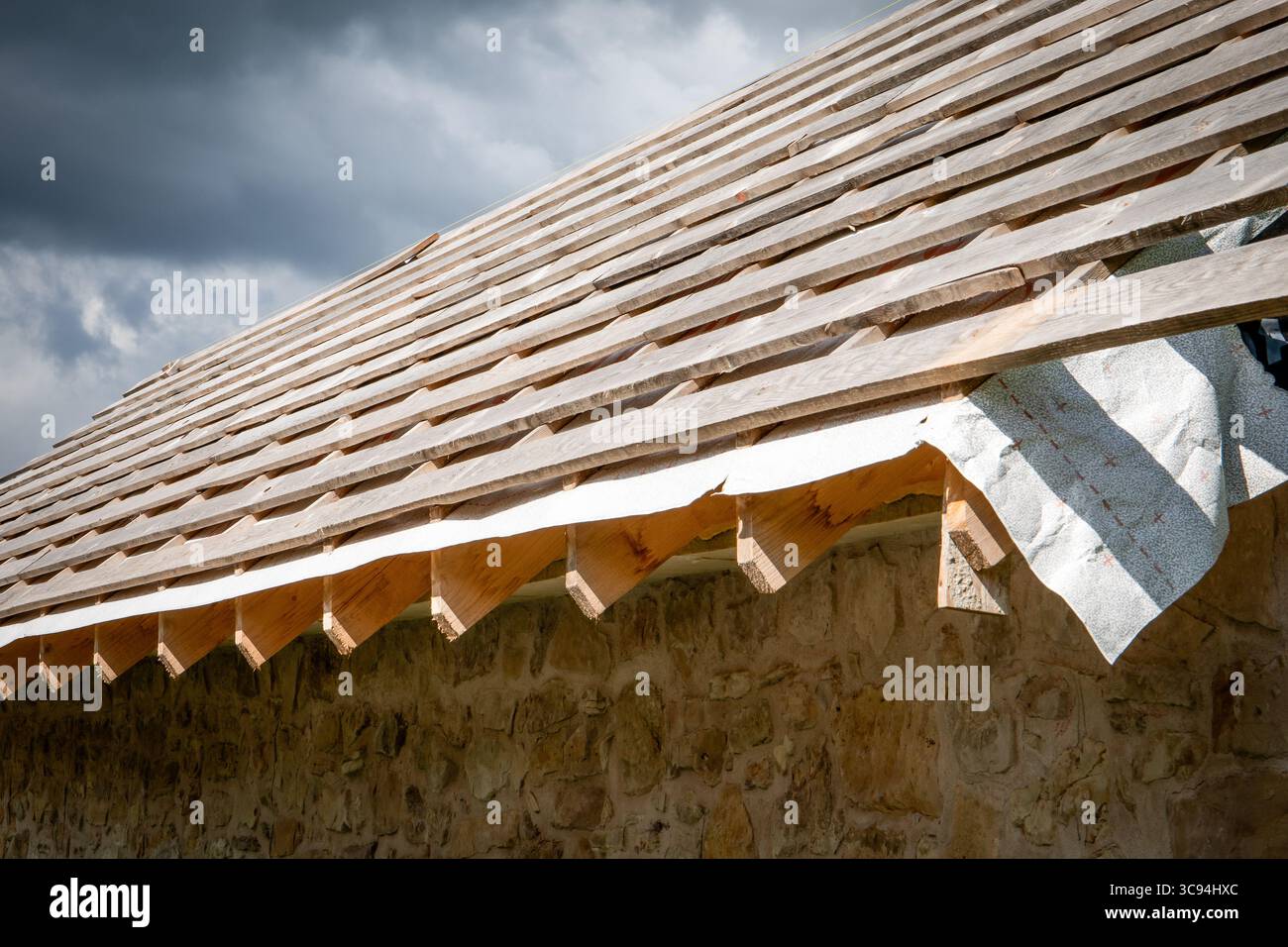 Wooden Roof Construction with Battens on Stone House under Dark Sky ...