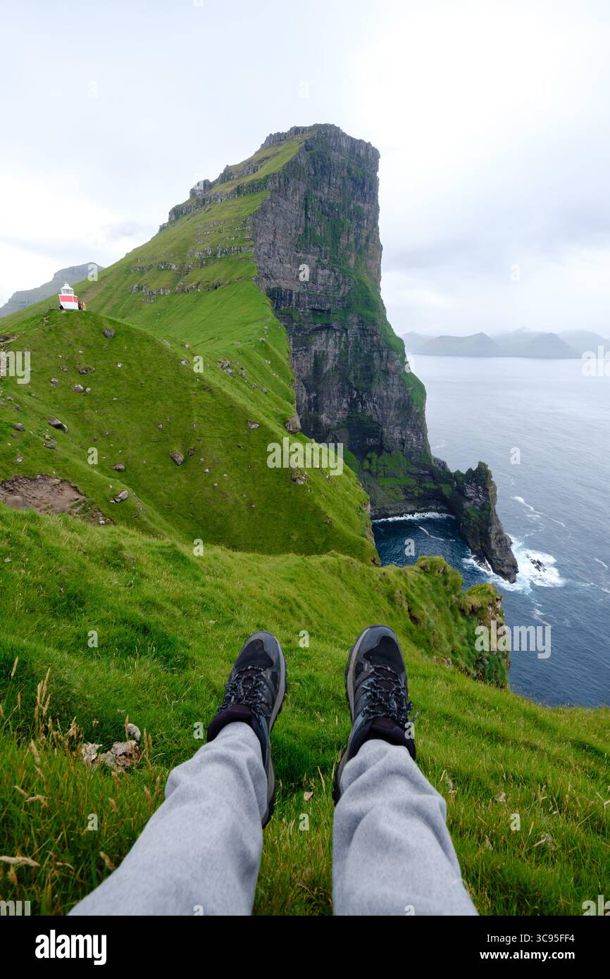 Stunning cliffs rise dramatically above the Atlantic Ocean in the Faroe ...