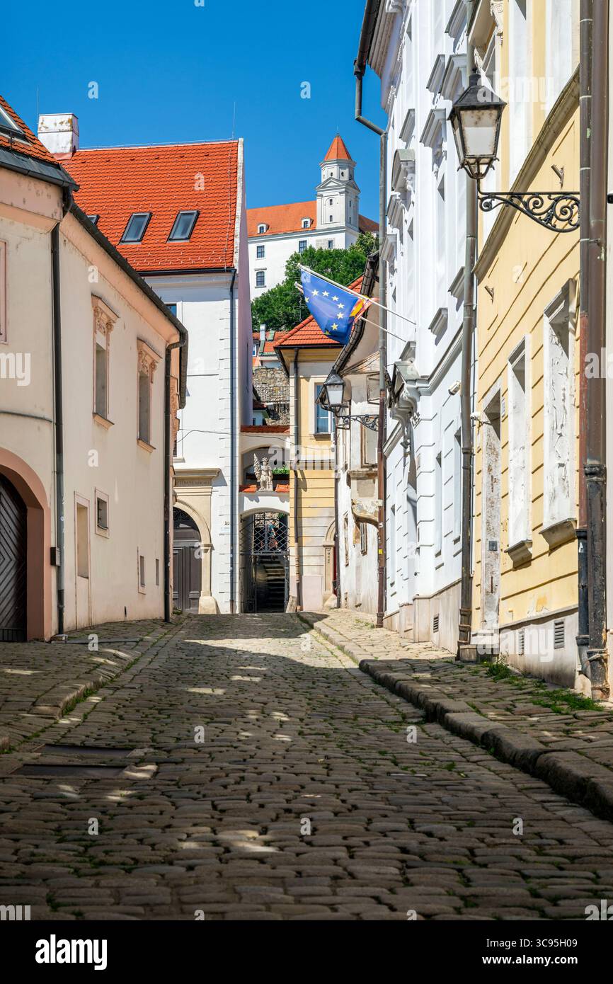 Old town's street and castle in the background, Bratislava, Slovakia ...