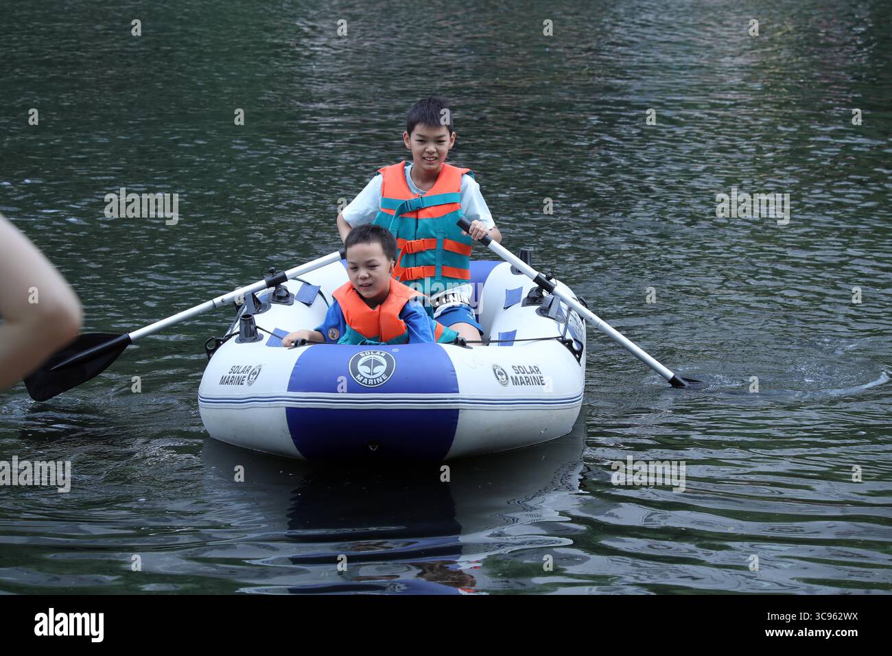 People experience canoeing on Liangma River in Beijing, China, 2 August ...