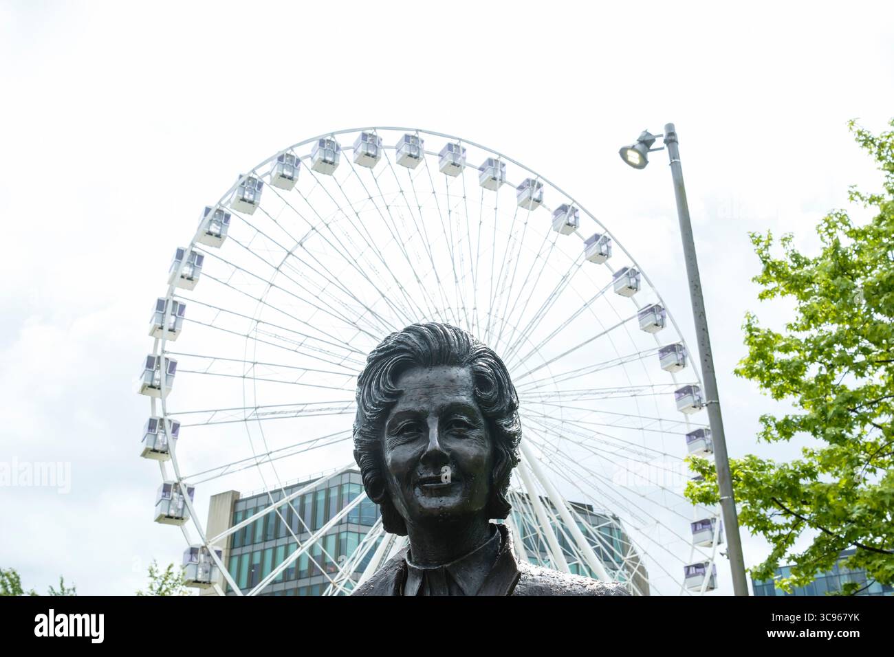 Statue of Barbara Castle and the big wheel in Cathedral Square ...