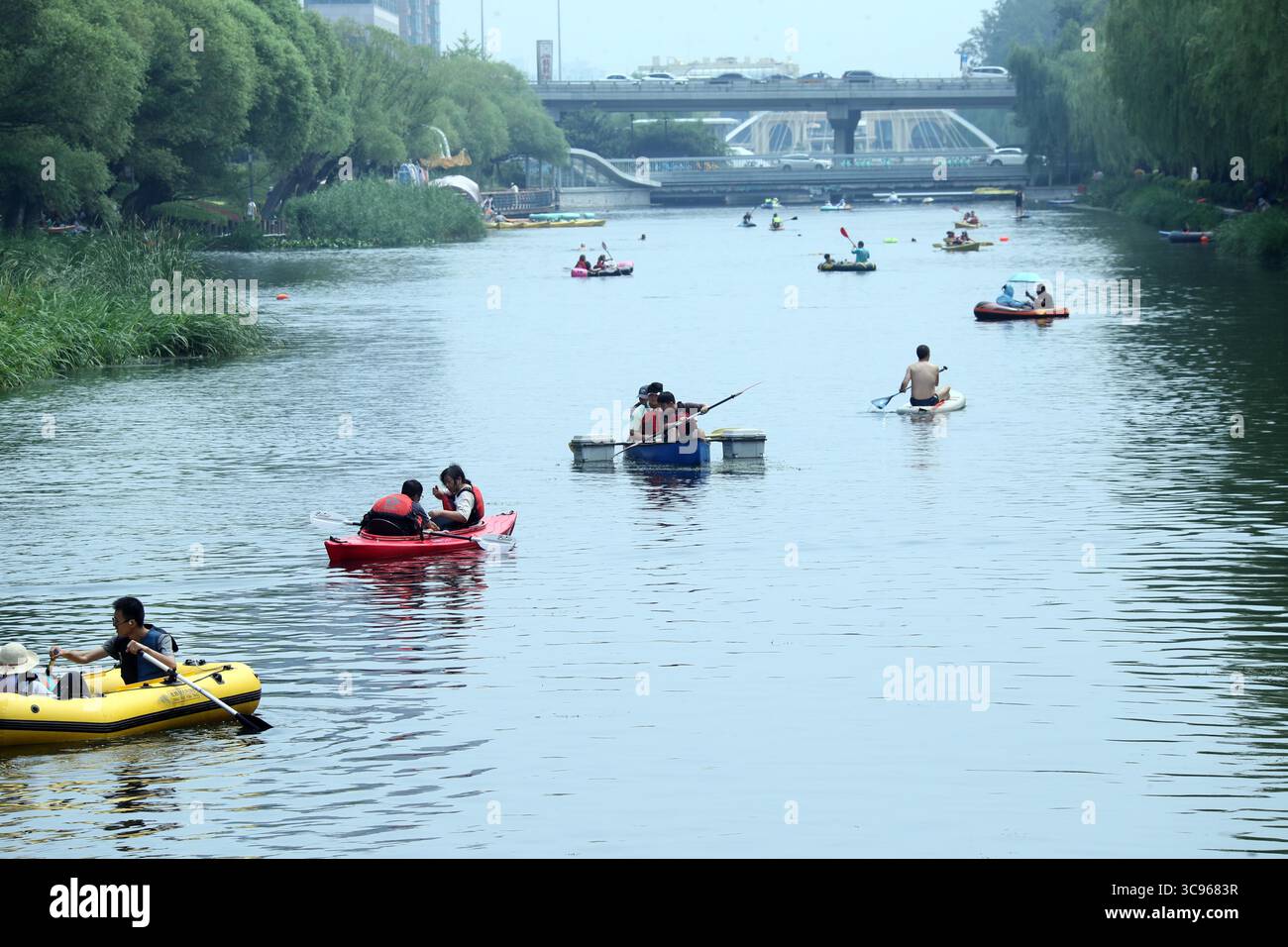 People experience canoeing on Liangma River in Beijing, China, 2 August ...