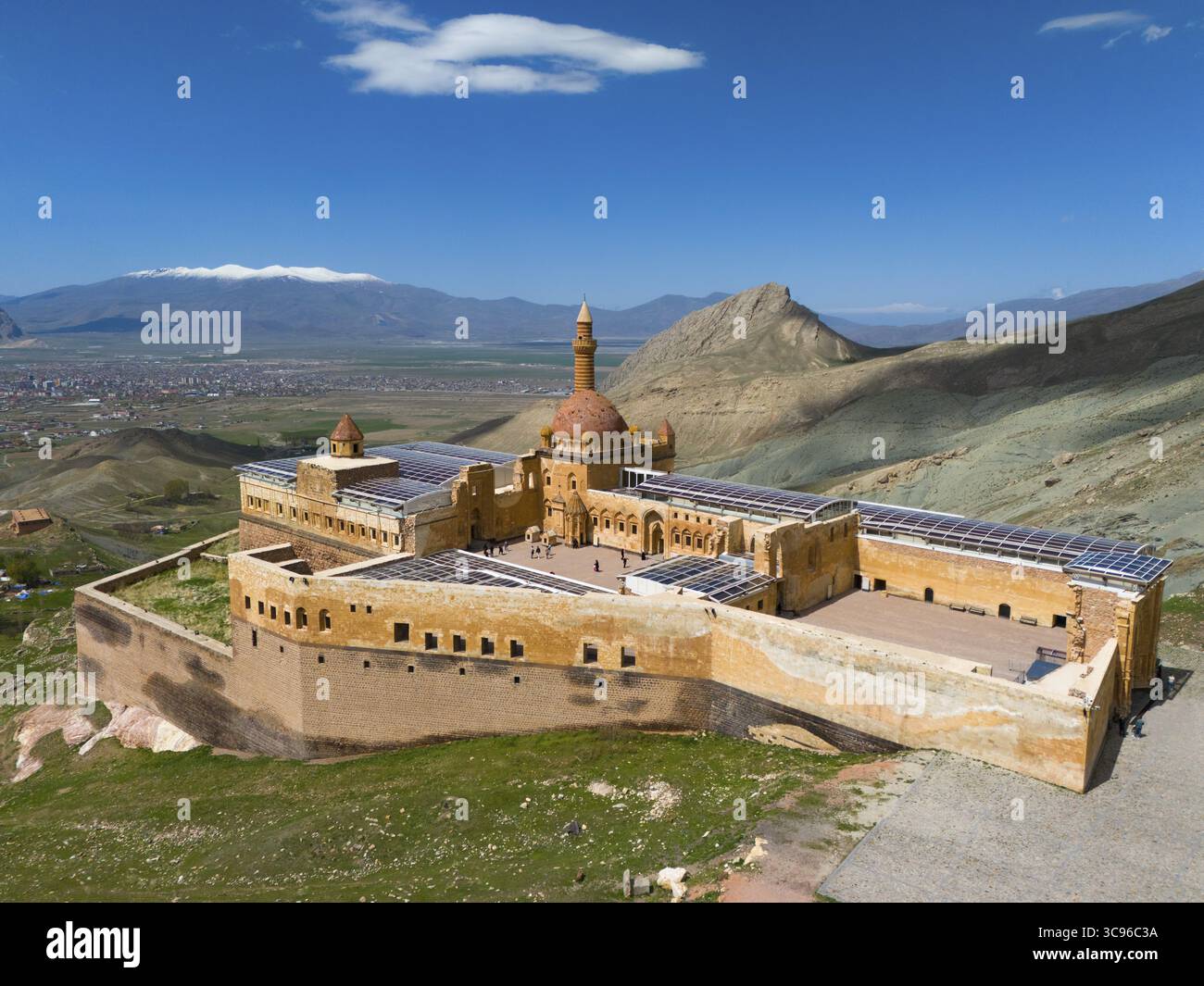 Majestic ancient fortress in front of a vast mountain panorama and deep ...
