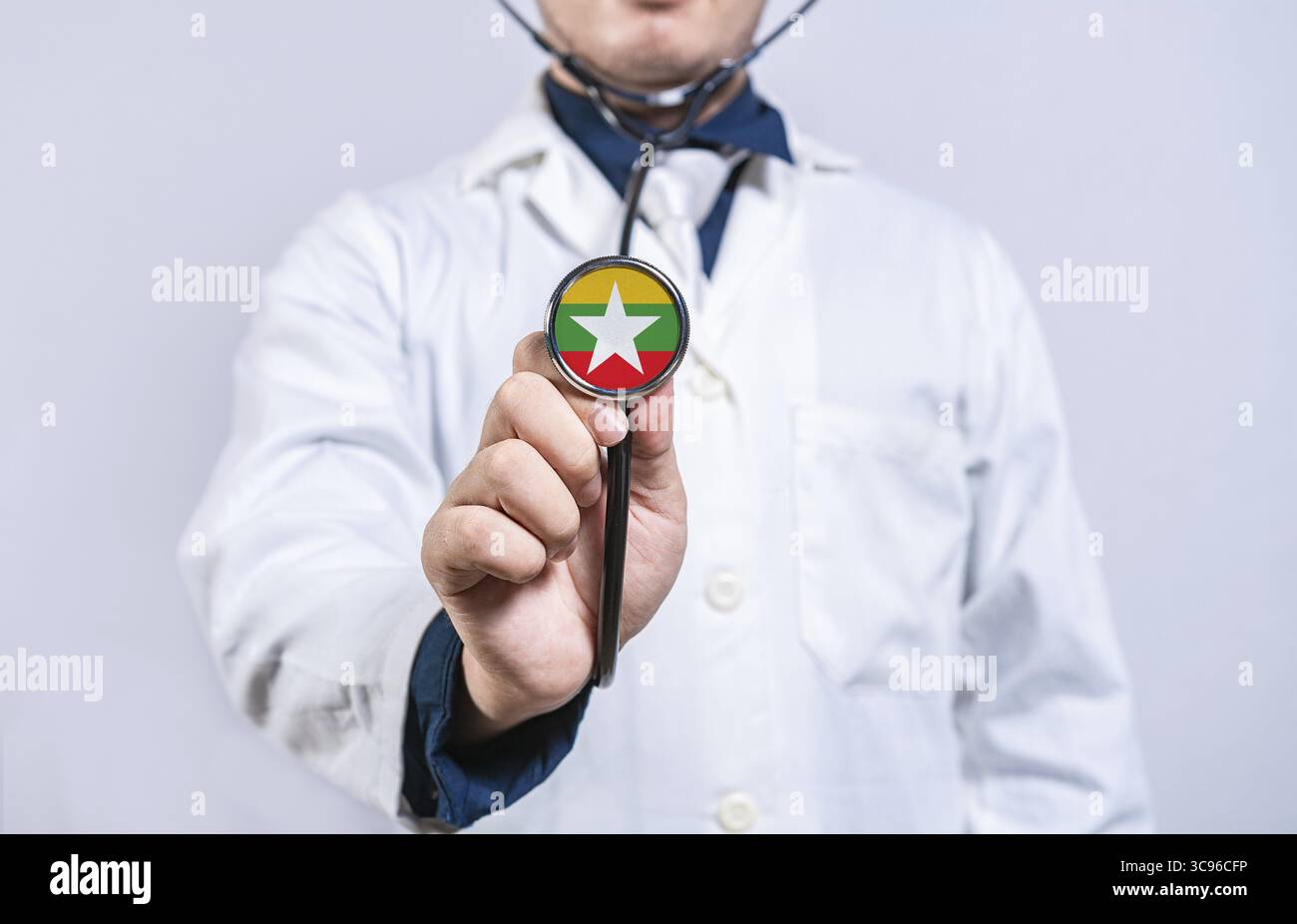 Doctor hands holding stethoscope with Myanmar flag. Myanmar health and ...