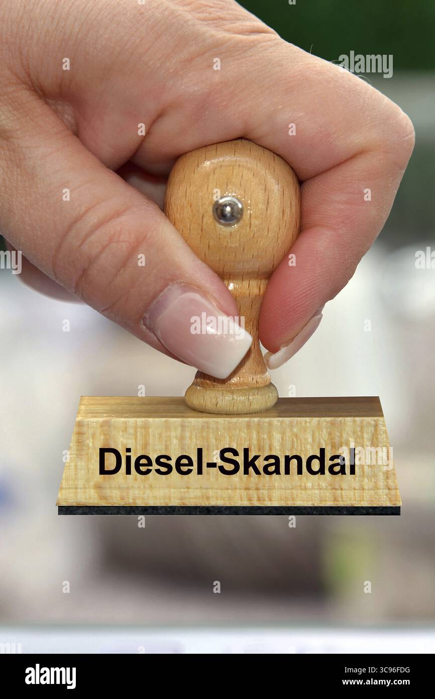 Symbol photo, woman's hand with stamp, inscription: Diesel scandal ...
