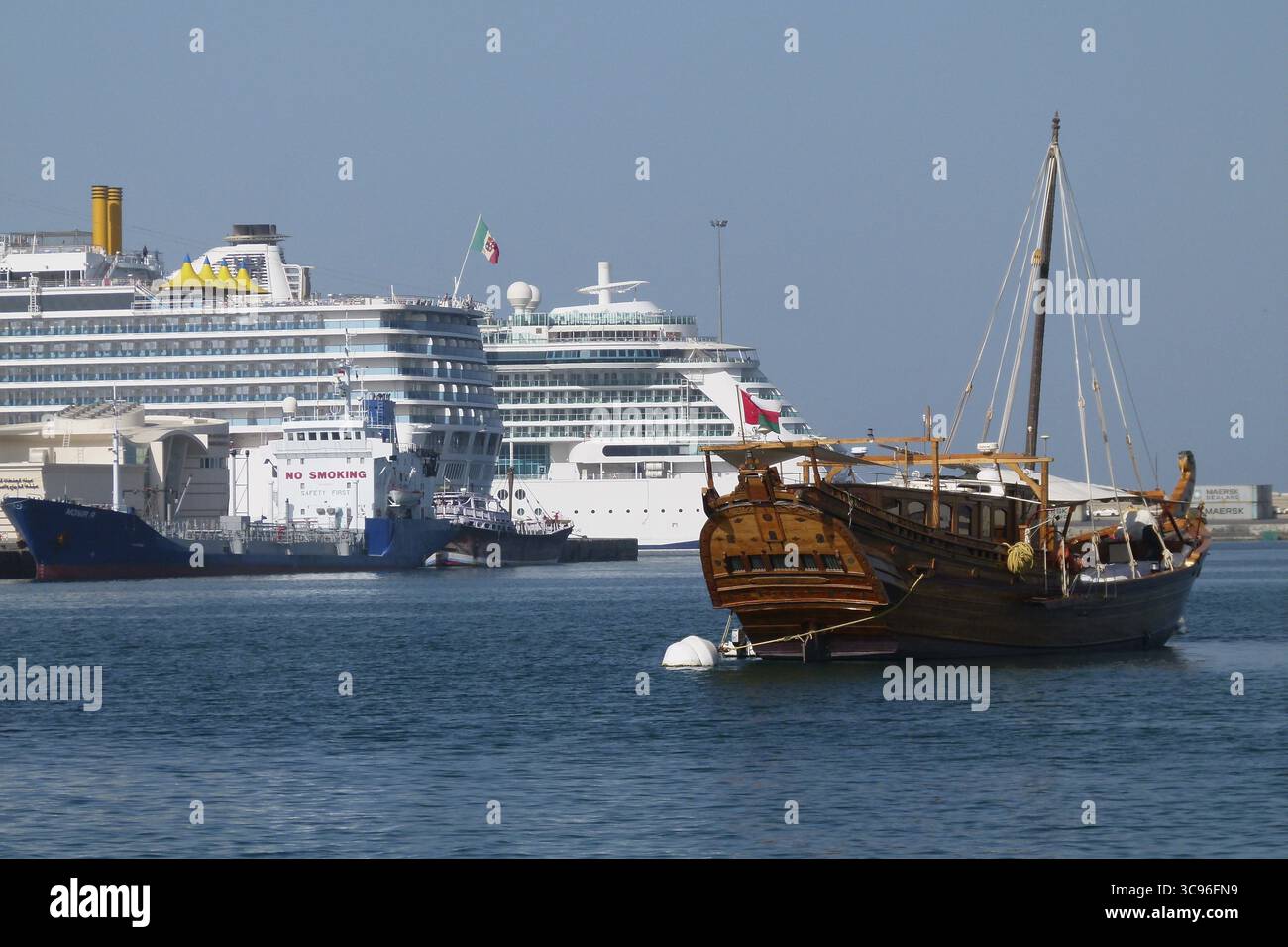 Old dhow and cruise ships, in the harbour of Muscat, Oman Stock Photo ...
