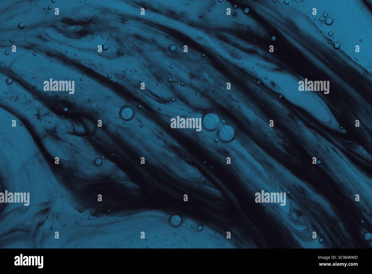 Macro textures of deep swirling liquid and air bubbles. Rich tones ...