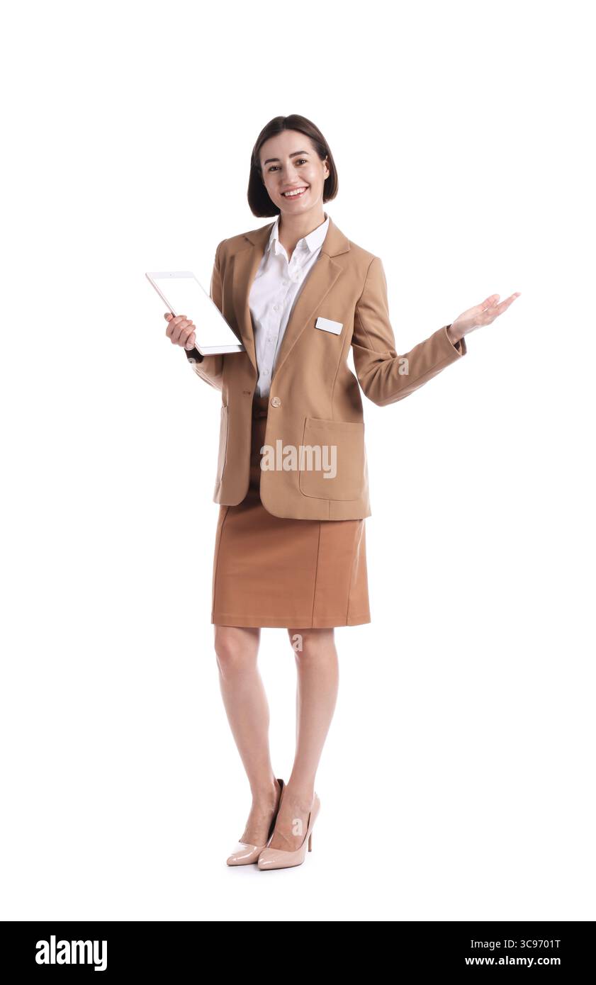 Smiling hostess in uniform with tablet on white background Stock Photo ...