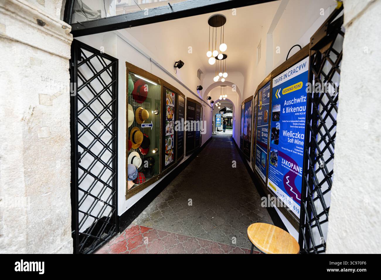 Krakow, Poland - July 08, 2025: A Krakow passage featuring tour ...