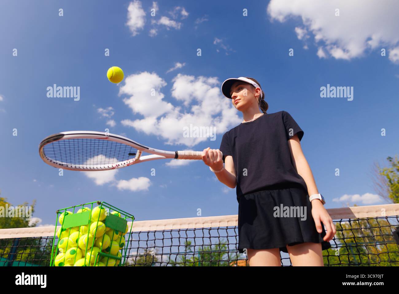 Female tennis player training on court, modern lesson with coach ...